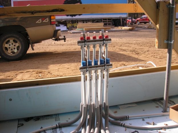 Running in Concrete Slab PEX Inside Large Tubing - Hansen Buildings