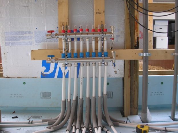 Running in Concrete Slab PEX Inside Large Tubing - Hansen Buildings